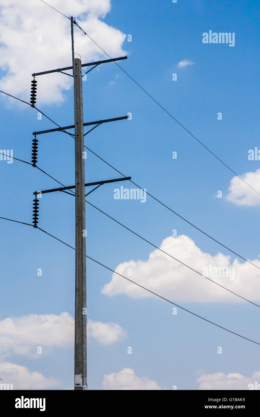Electricity post and clouds blue sky background Stock Photo - Alamy