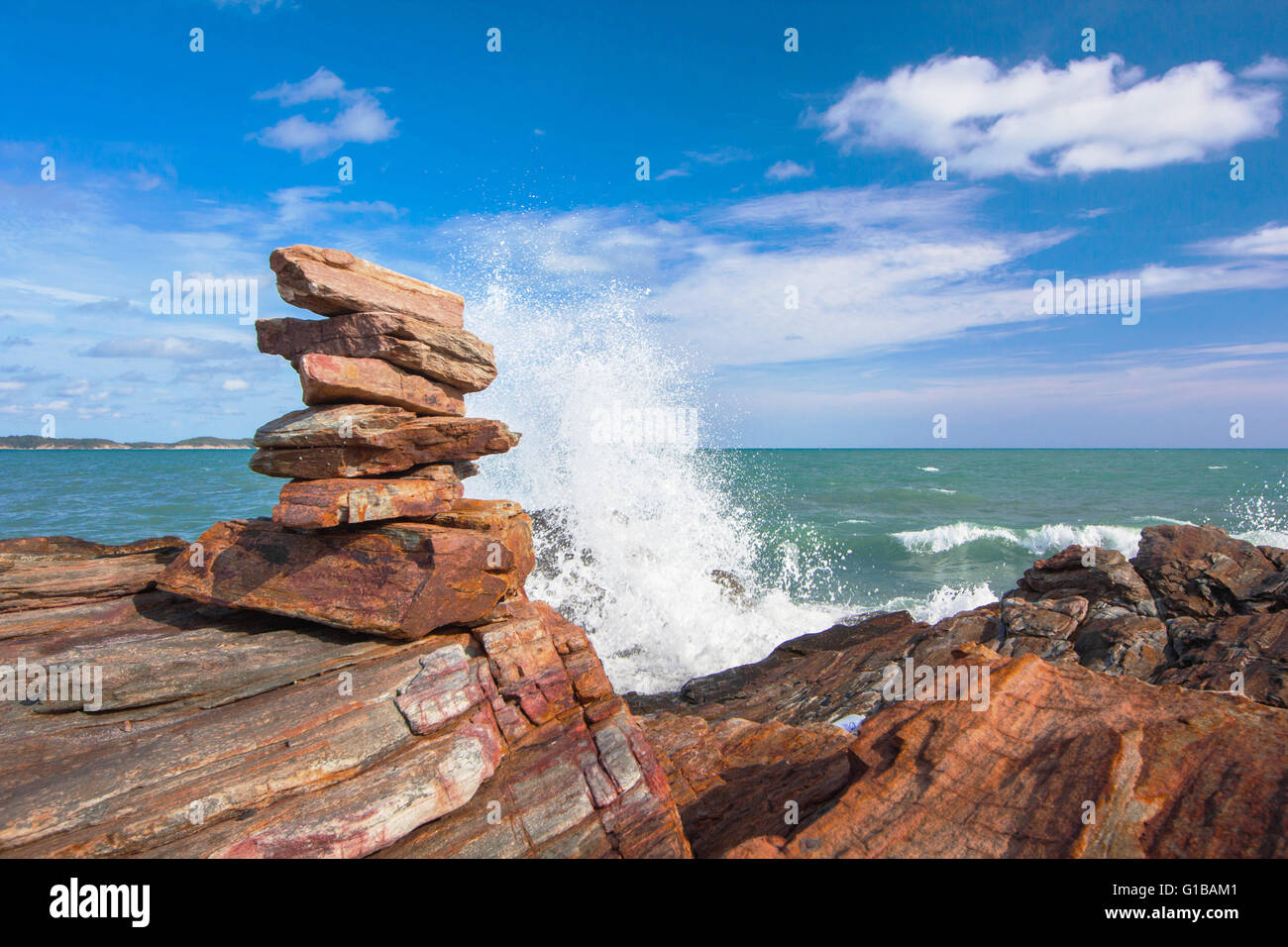 sea beach stone stack stable and wave splash abstract and blue sky ...