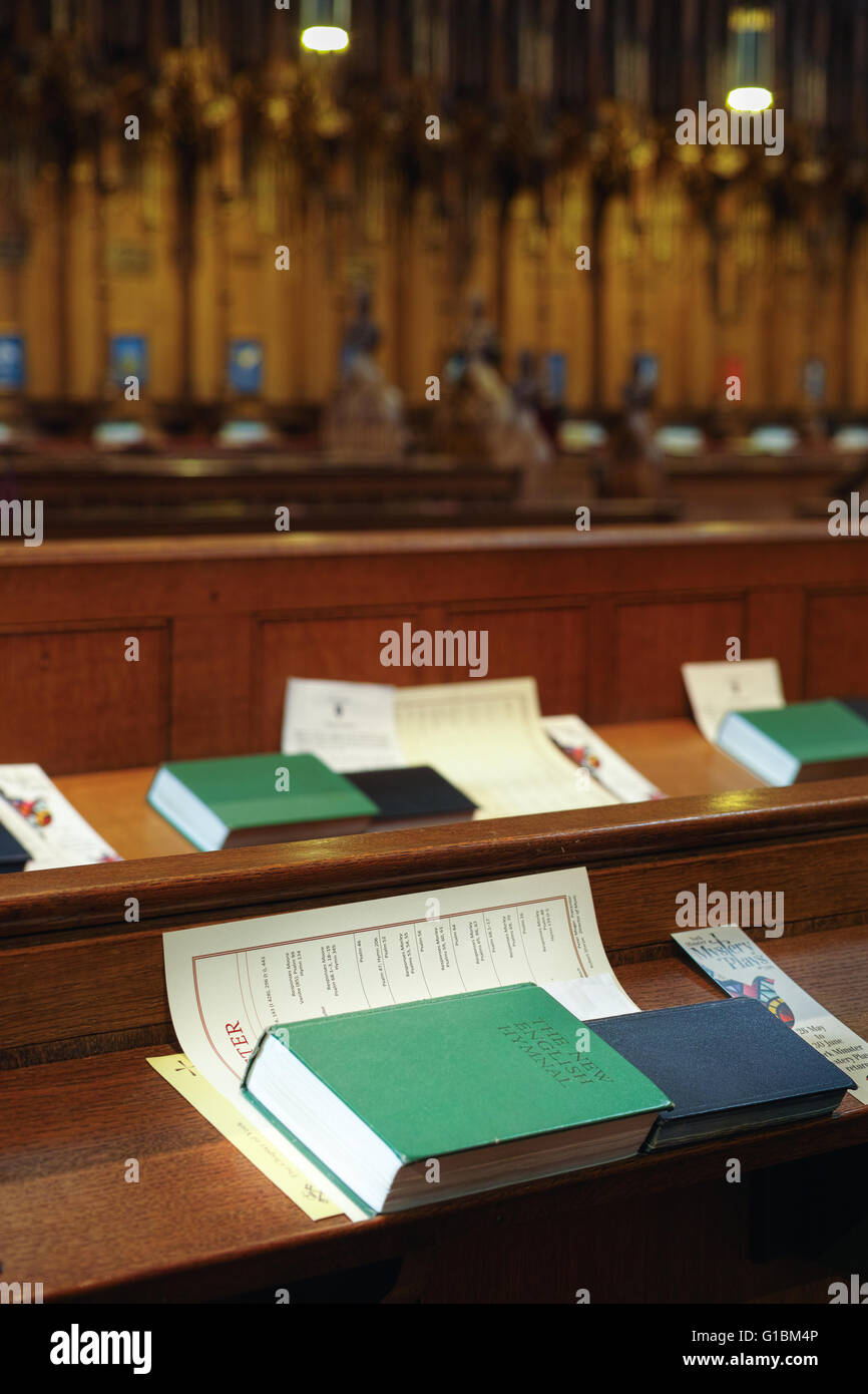 Hymn book on shelf in the quire (choir) of York minster, England Stock ...