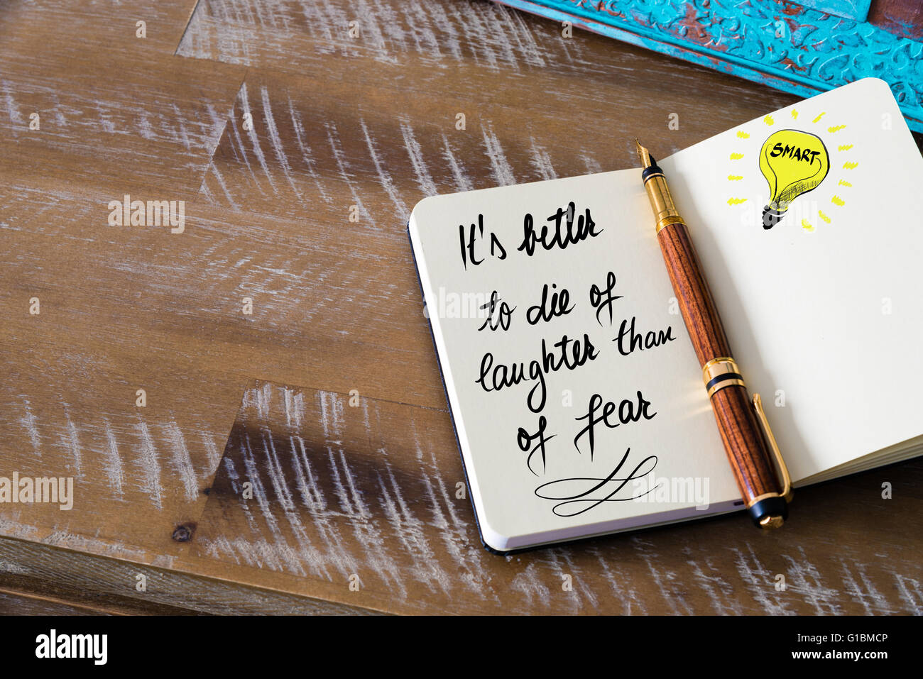 Handwritten text It’s better to die of laughter than of fear with ...