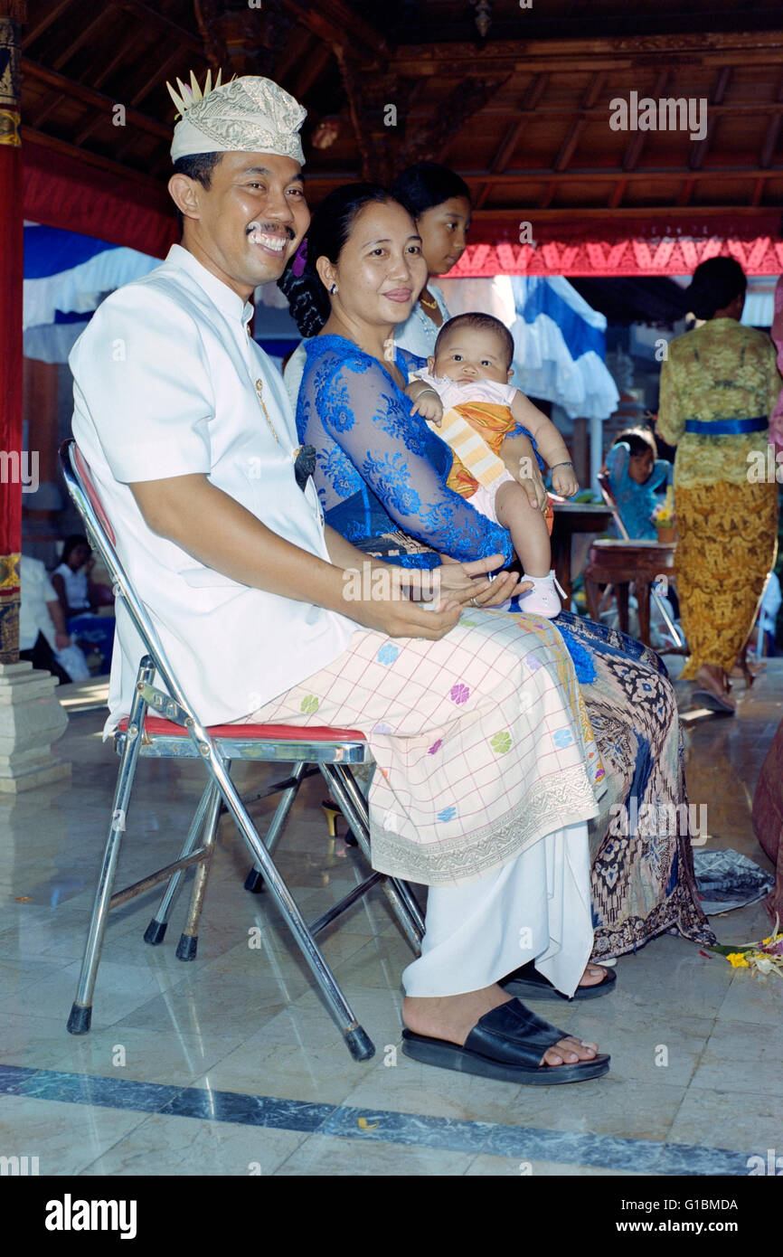 parents with baby at a hindu religious ceremony kuta bali indonesia ...