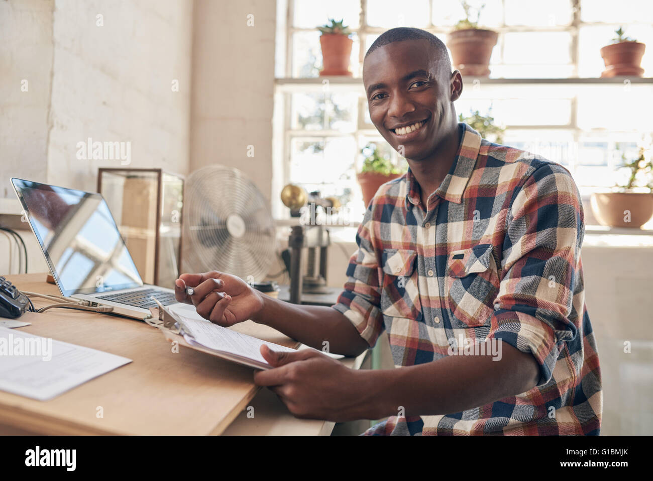 Portrait of a handsome young African entrepreneur and small business ...