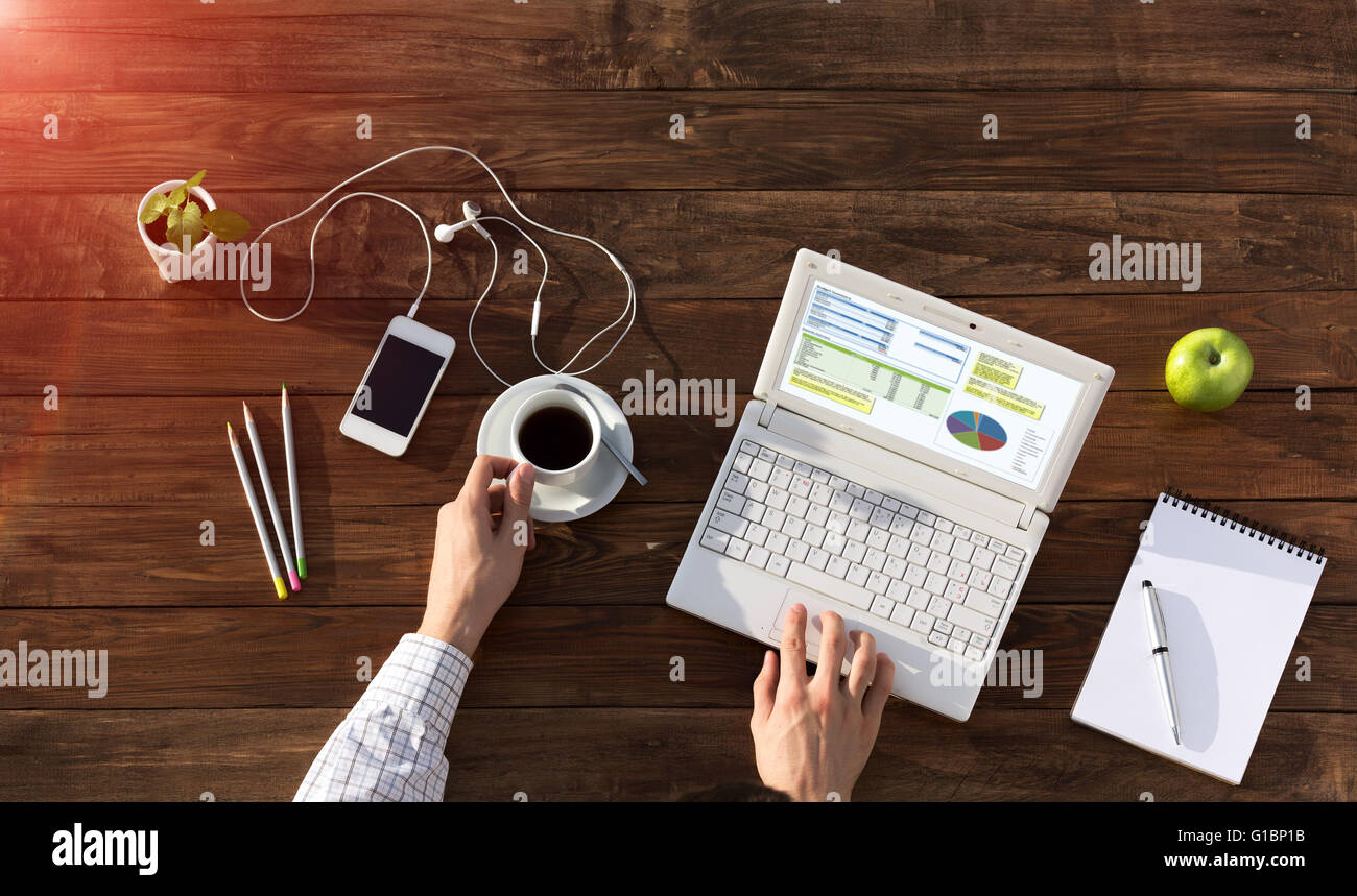 Man working on Computer at wooden Desk overhead View Stock Photo - Alamy