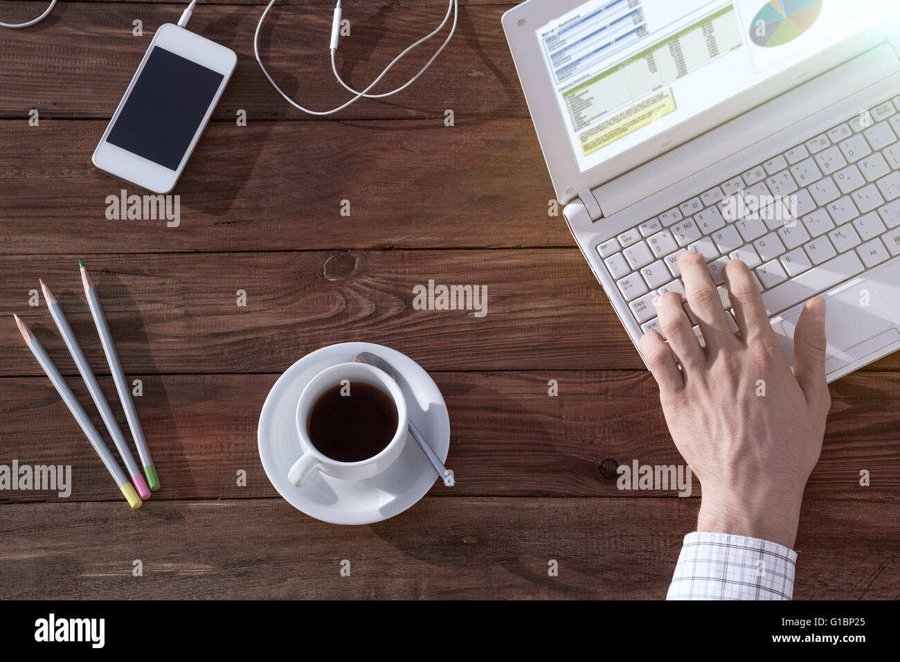 Man working on Computer at wooden Desk overhead View Stock Photo - Alamy