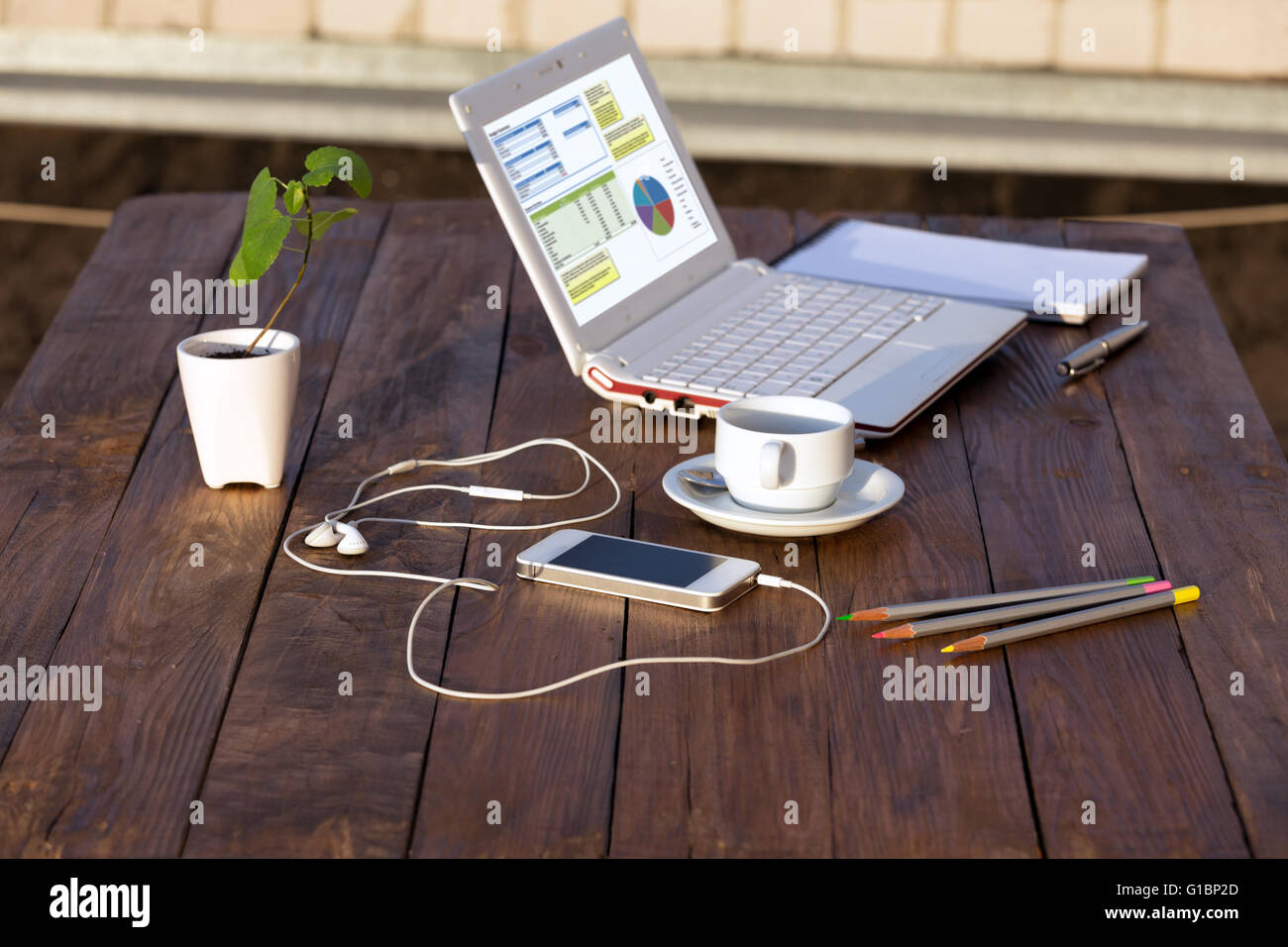 Side view of working Place on natural wooden Table Stock Photo - Alamy