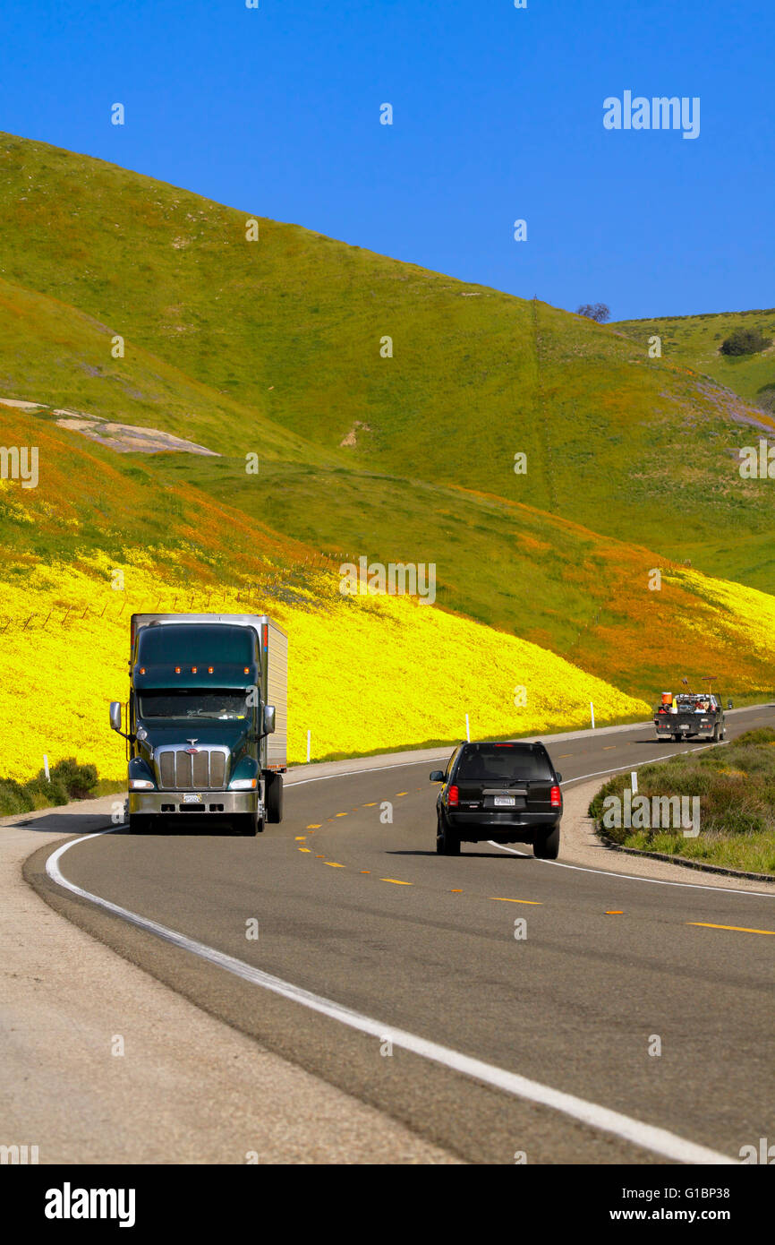 Cars and truck on California highway 41 to Paso Robles during golden ...