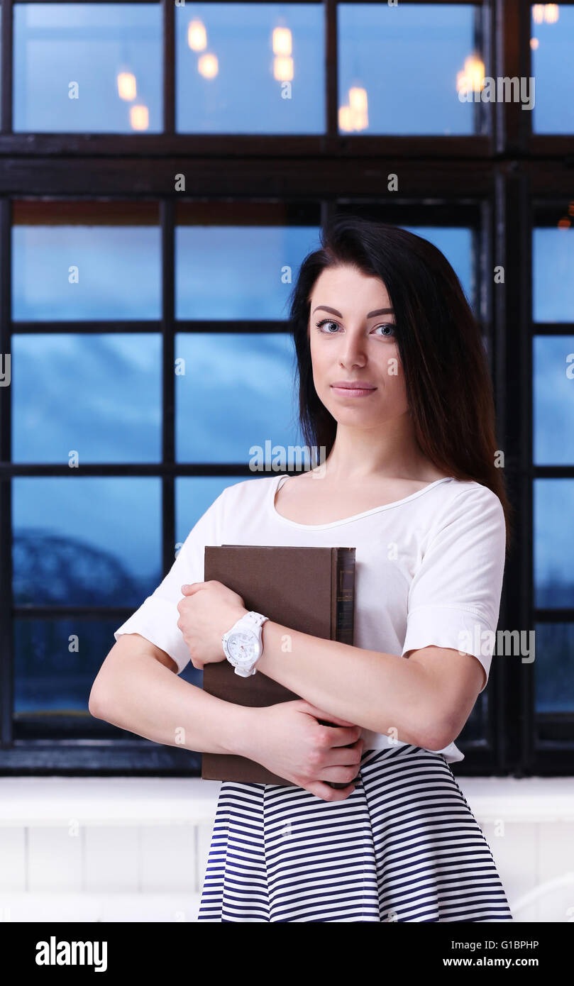 Girl holding dictionary hi-res stock photography and images - Alamy
