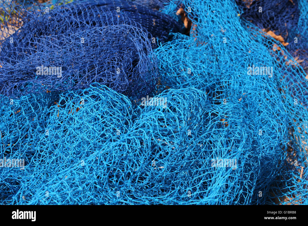 blue fishing nets background Stock Photo - Alamy