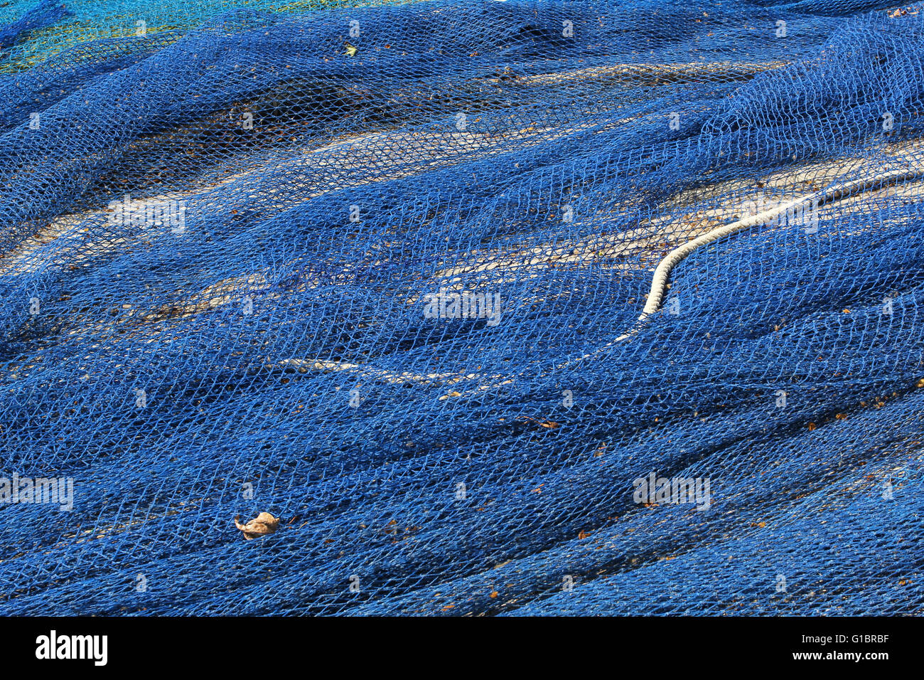 blue fishing nets background Stock Photo - Alamy