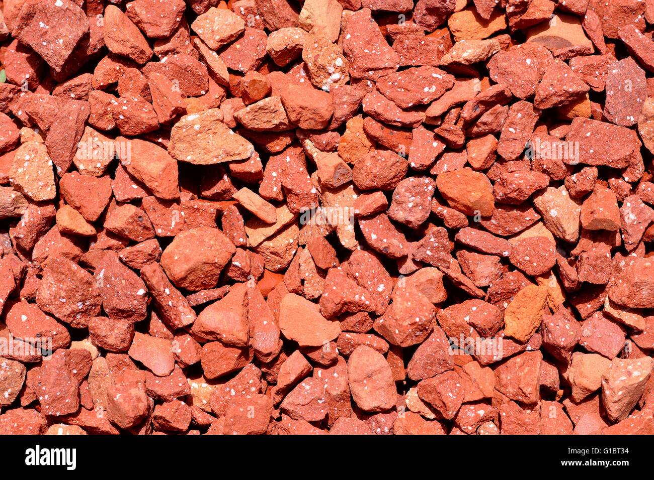 Background of small red rocks Stock Photo - Alamy