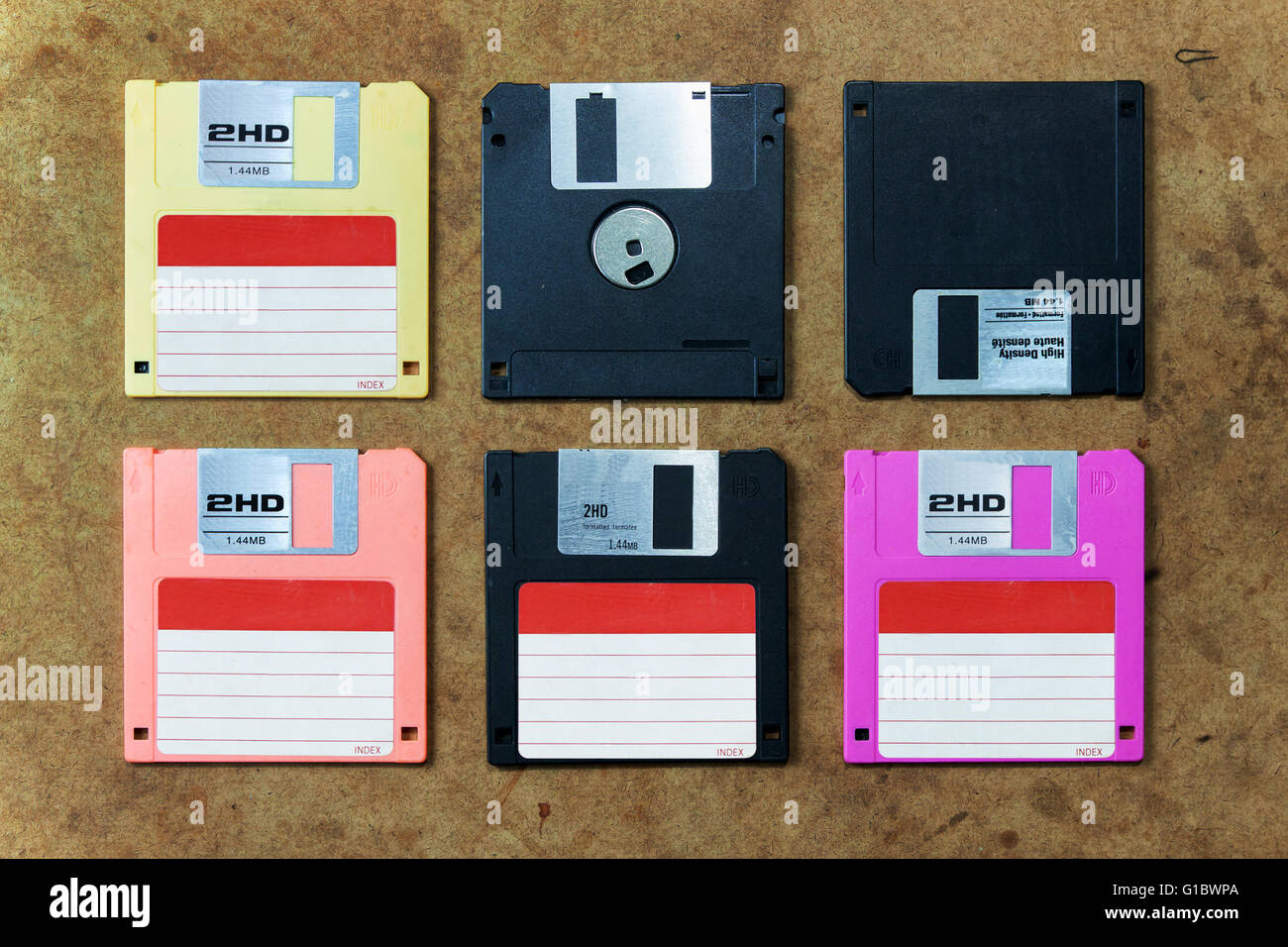 floppy disk in various colors. flat lay on wood board Stock Photo - Alamy