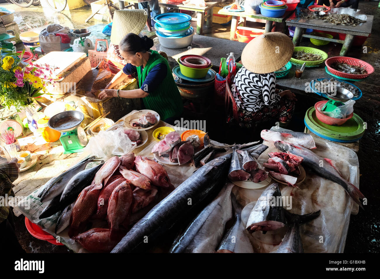 Ladies on their fish stalls in Hoi An Central Market Stock Photo - Alamy