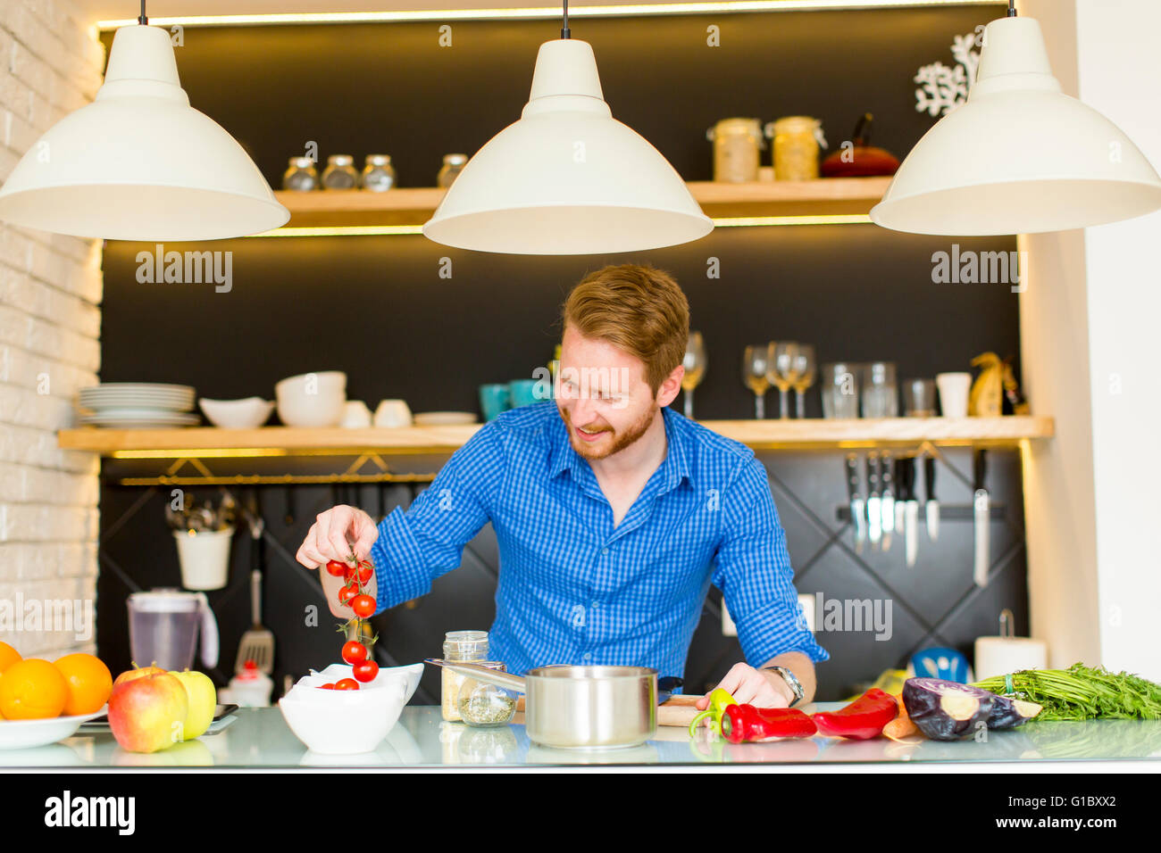 Young man preparing healthy food Stock Photo - Alamy