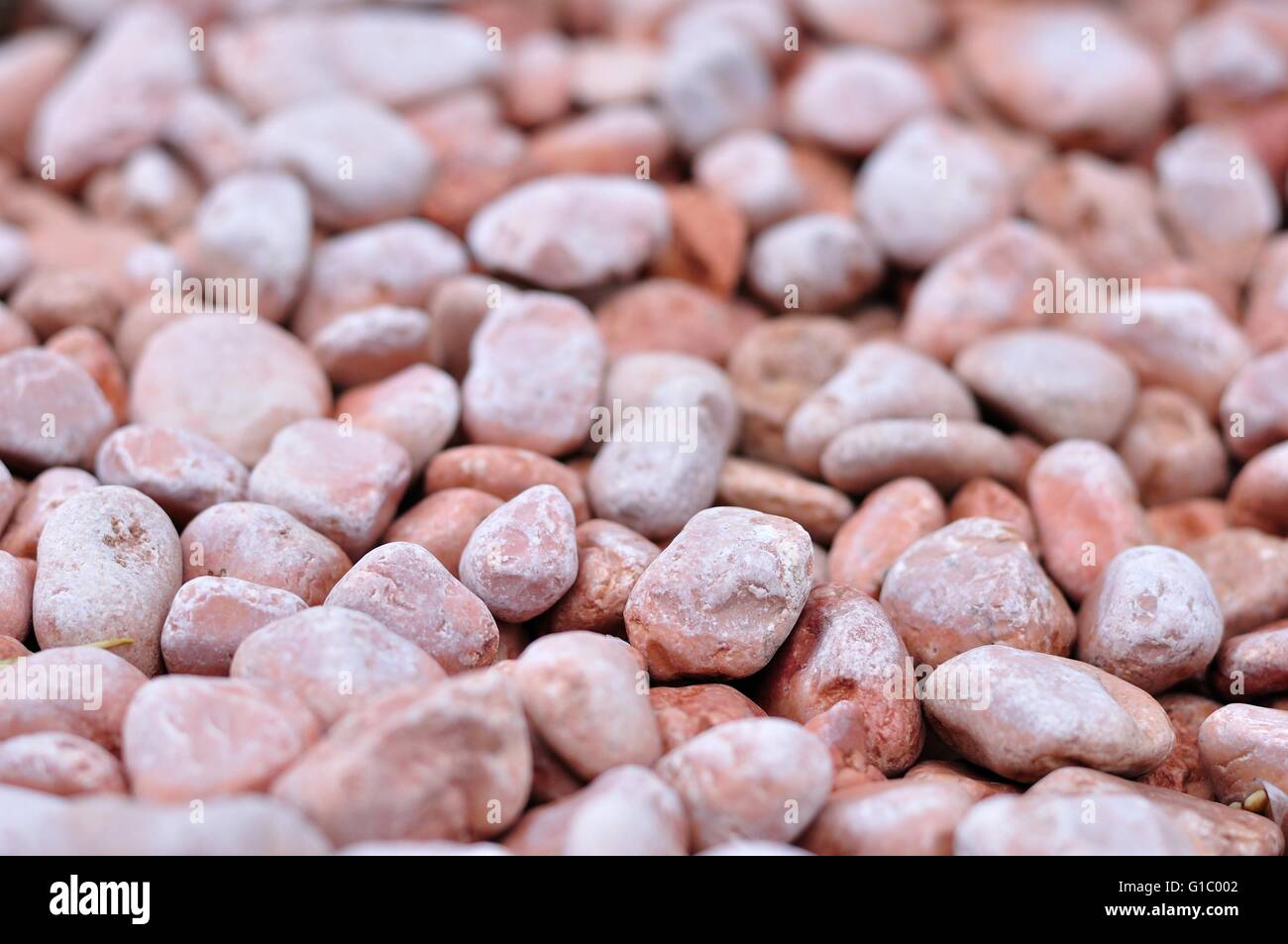 Background of small red rocks. Shallow DOF. Selective focus Stock Photo ...