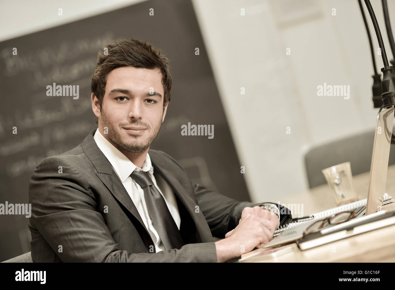 Portrait of smiling Businessman posing in coworking office Stock Photo ...