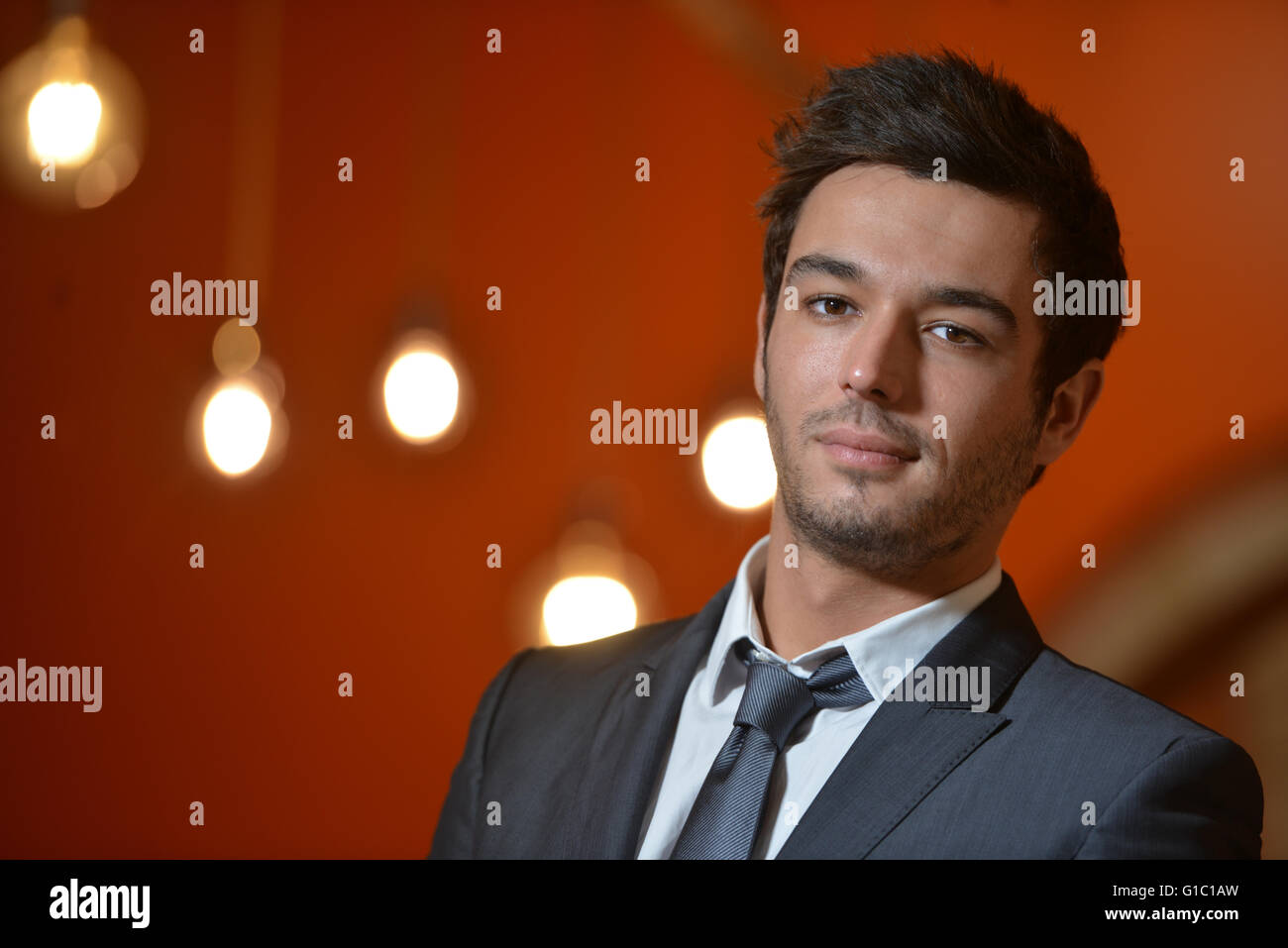 Portrait of smiling Businessman posing in coworking office Stock Photo ...