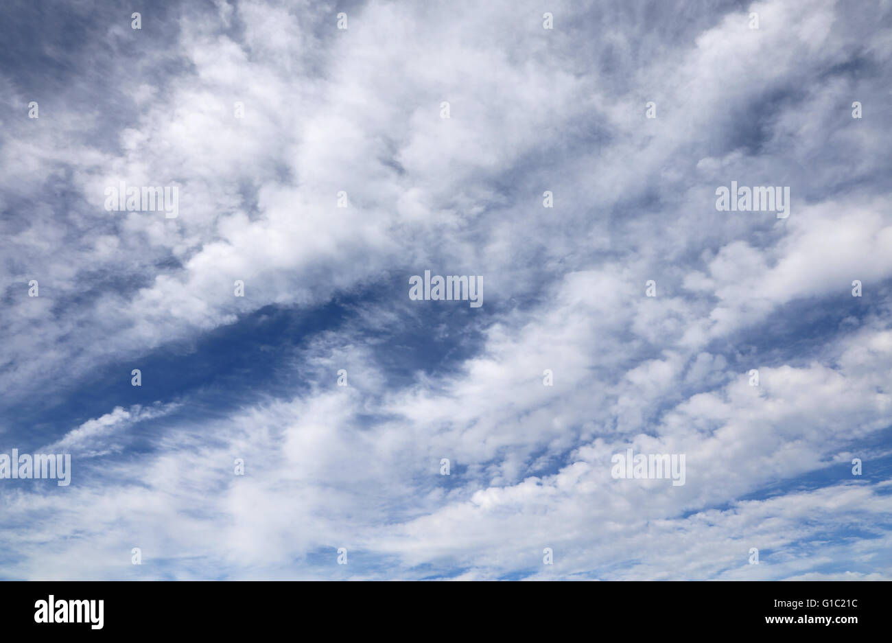 many white clouds of all shapes in the blue sky Stock Photo - Alamy