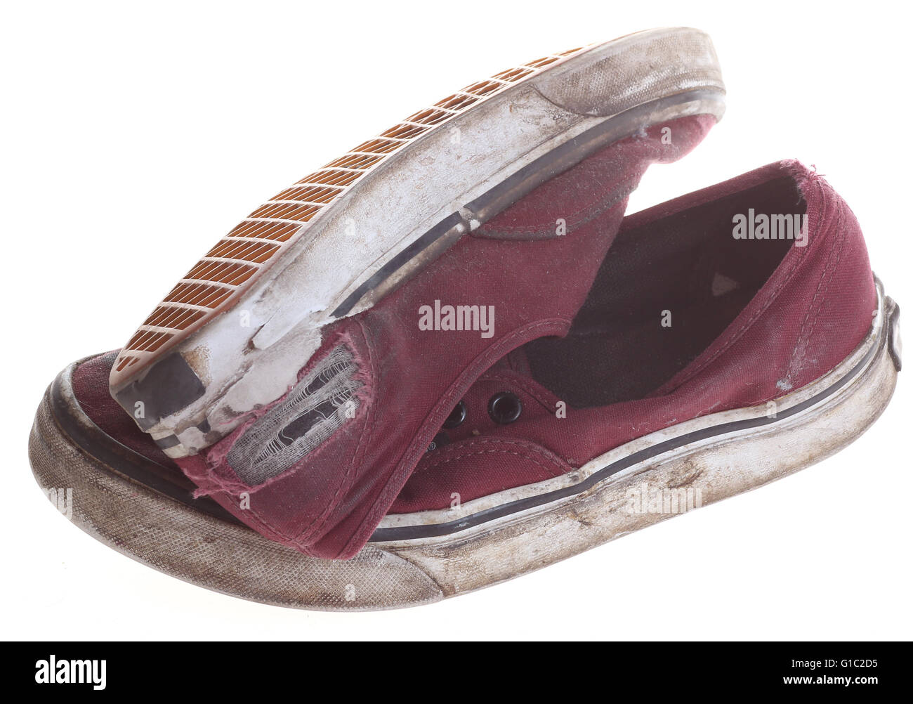 Very old and worn out pair of dark red or maroon sneakers, May 2016 ...