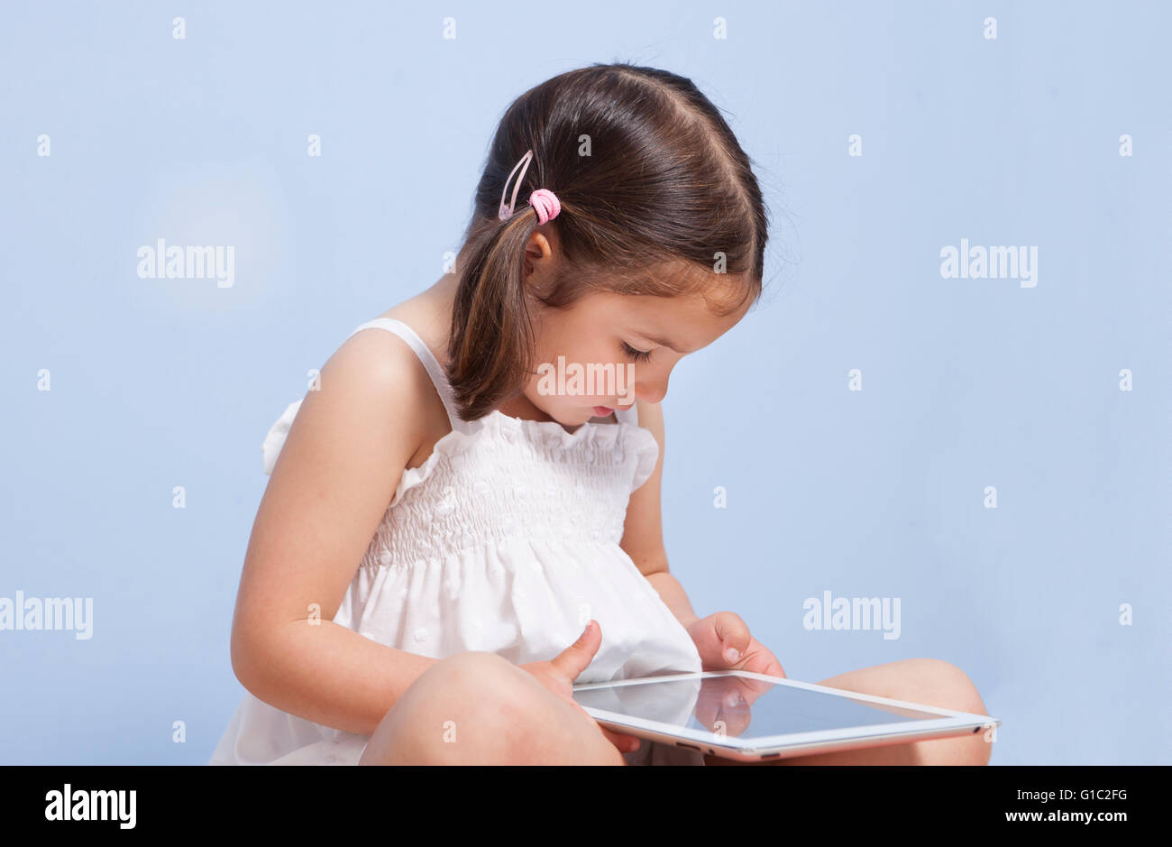 Little girl using computer hi-res stock photography and images - Alamy