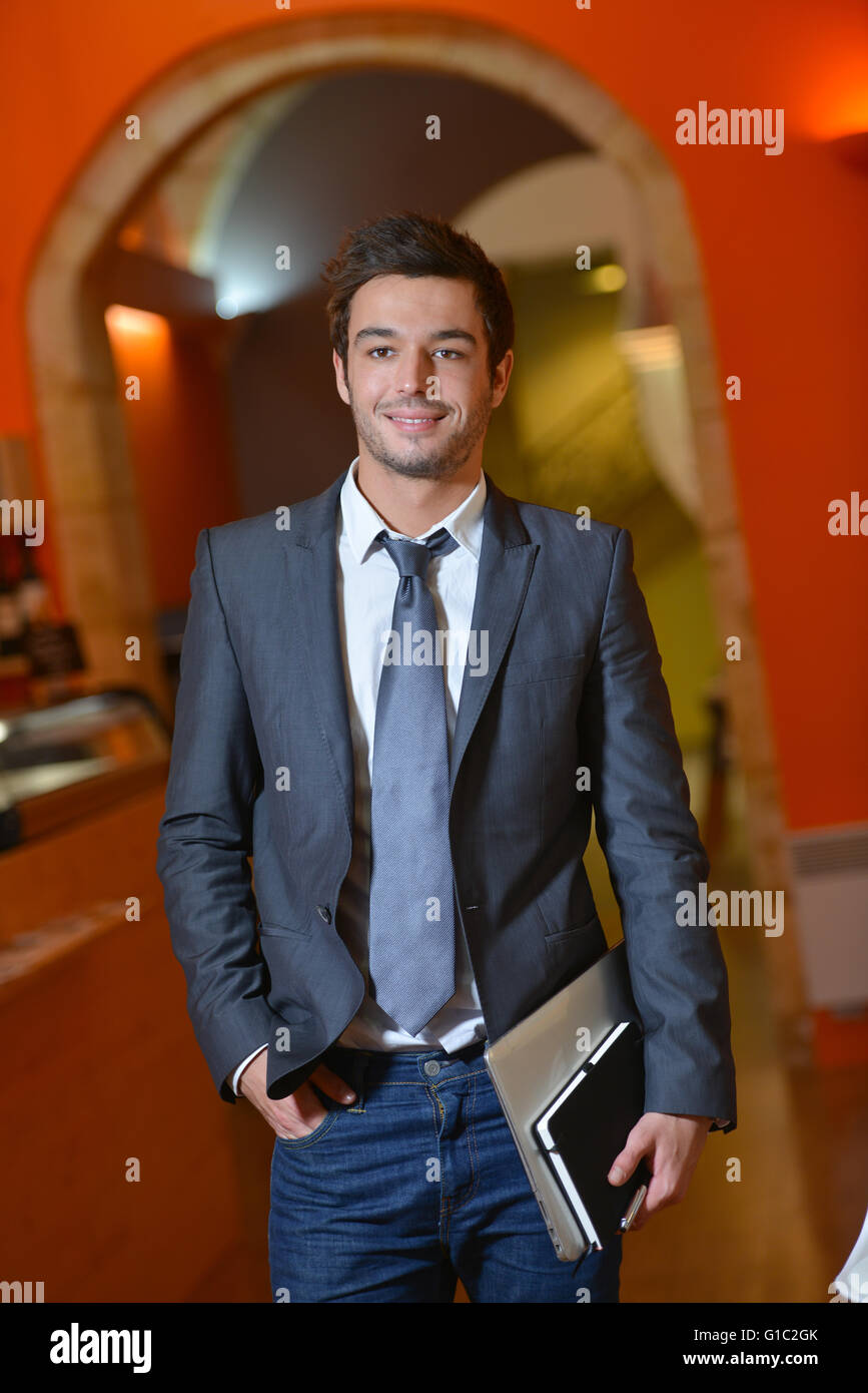 Portrait of smiling Businessman posing in coworking office Stock Photo ...