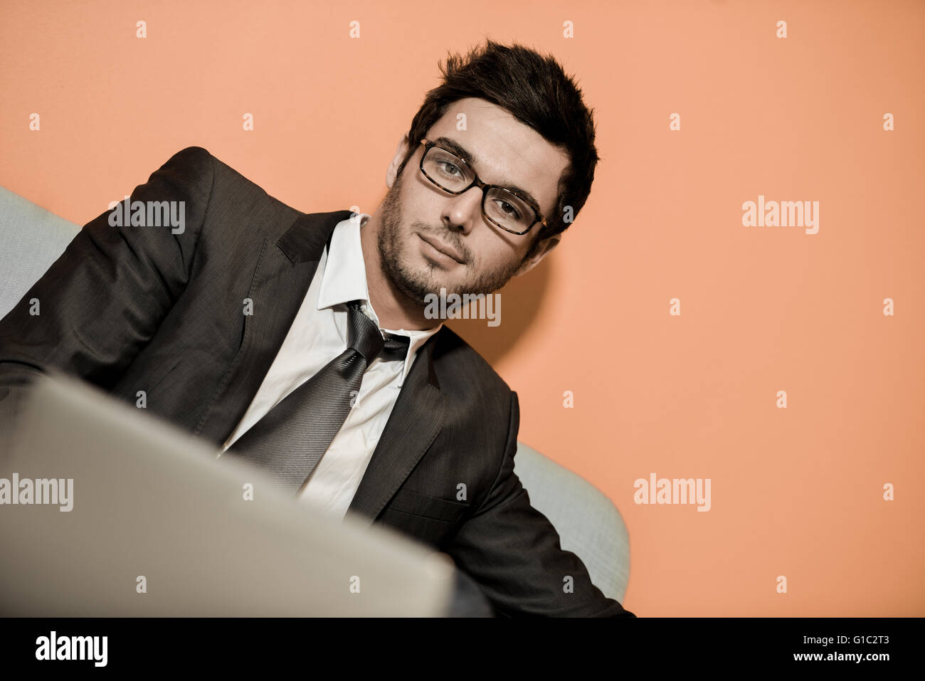 Portrait of smiling Businessman posing in coworking office Stock Photo ...