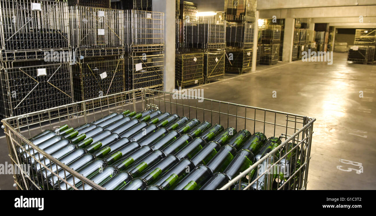 Wine bottles in industrial cellar Stock Photo - Alamy