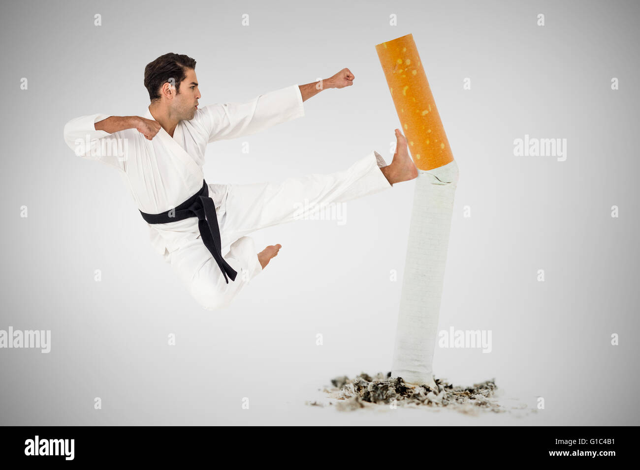 Composite image of fighter performing karate stance Stock Photo - Alamy