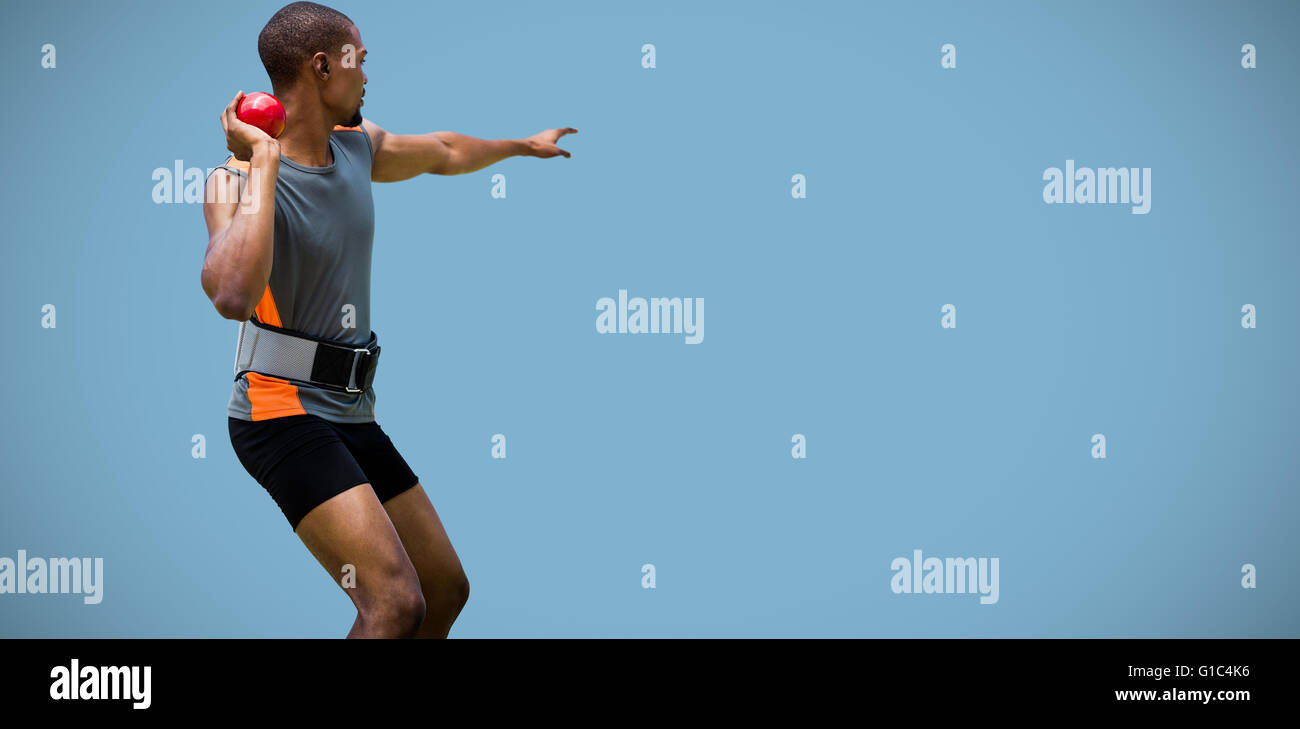 Composite image of rear view of sportsman practising shot put Stock ...