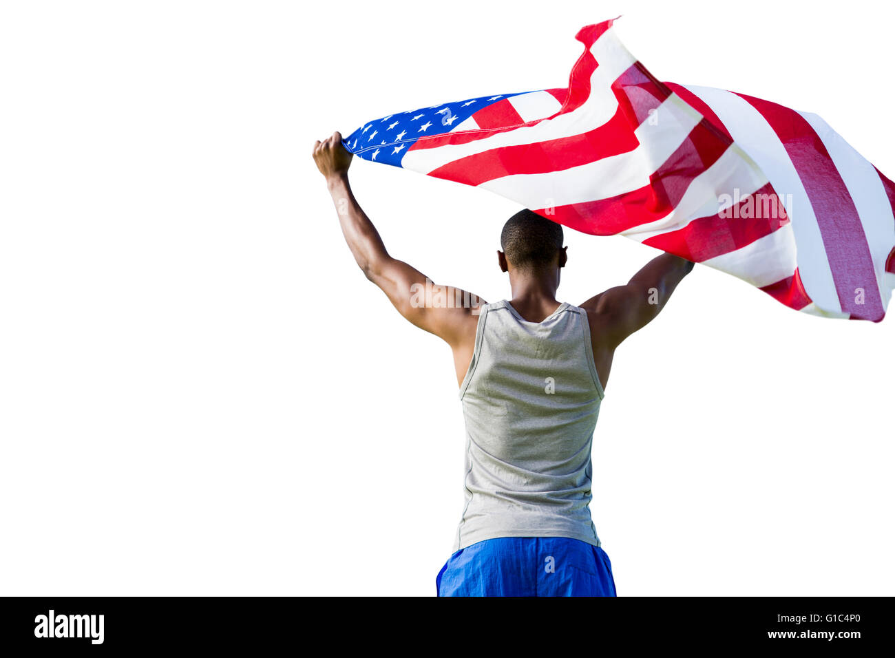 Rear view of athletic man holding the American flag Stock Photo - Alamy