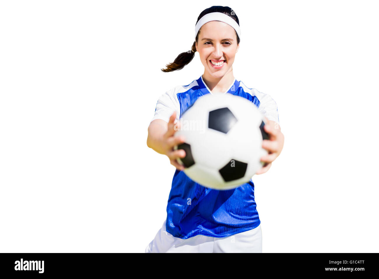 Woman soccer player posing with a ball Stock Photo - Alamy