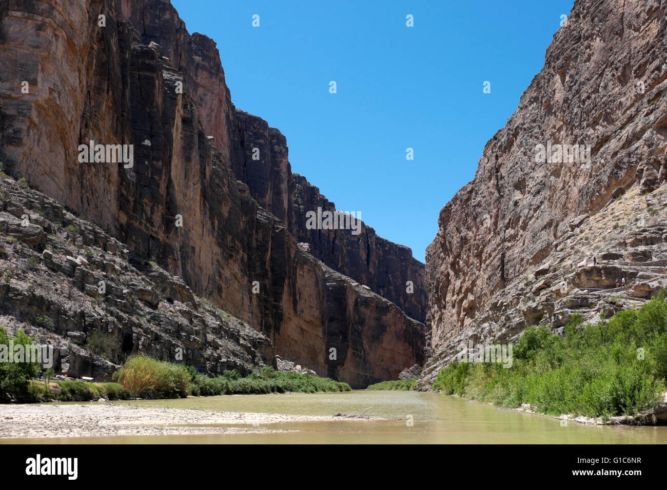 Limestone cliffs rise 1500 feet above the Rio Grande River in Big Bend ...