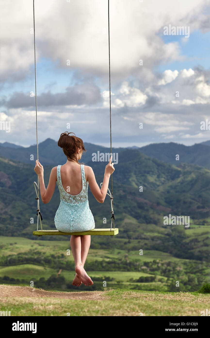 Girl dreaming on a swing Stock Photo - Alamy