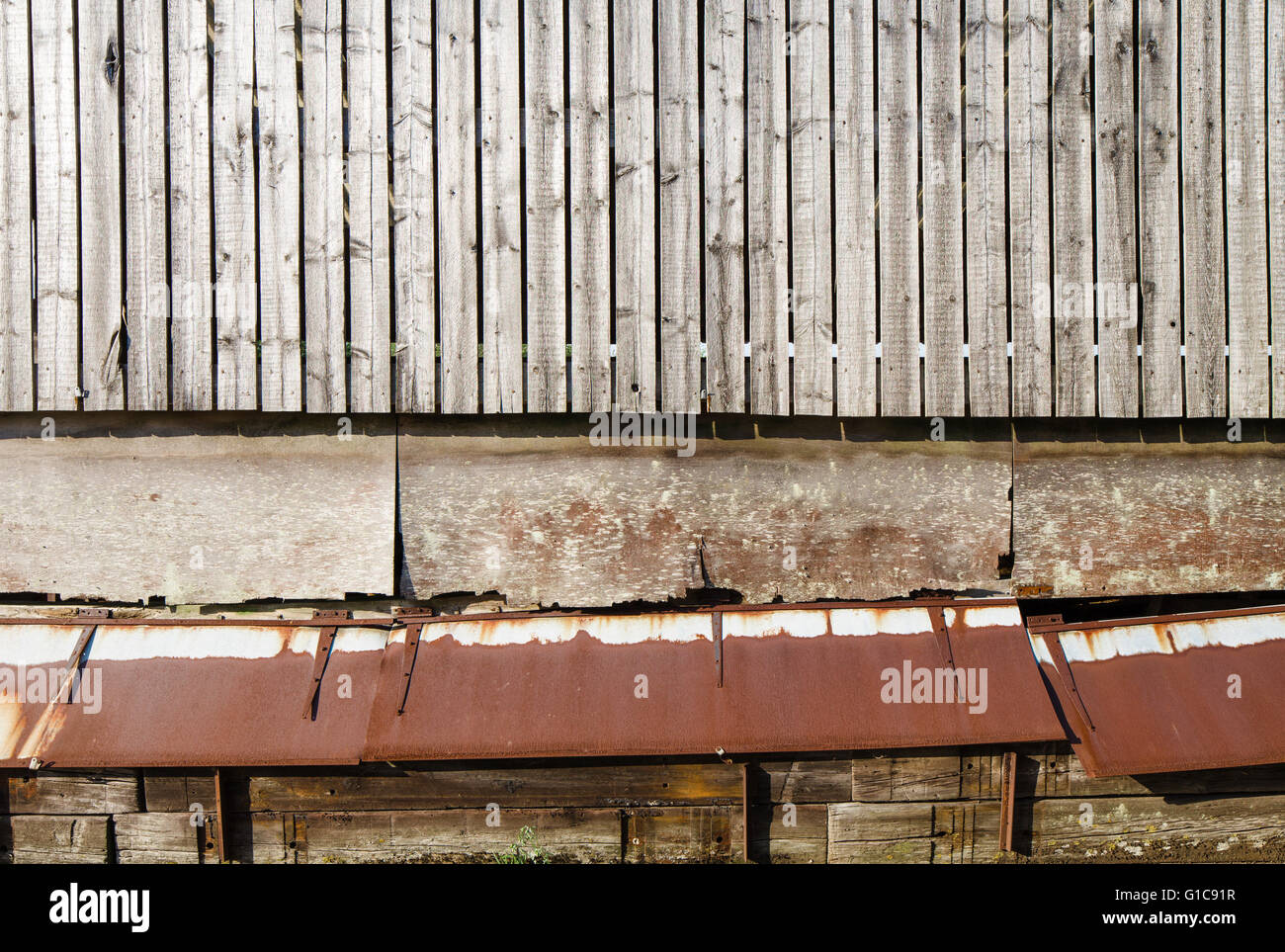 Textures of materials, including timber slats, rusted metal and plywood ...