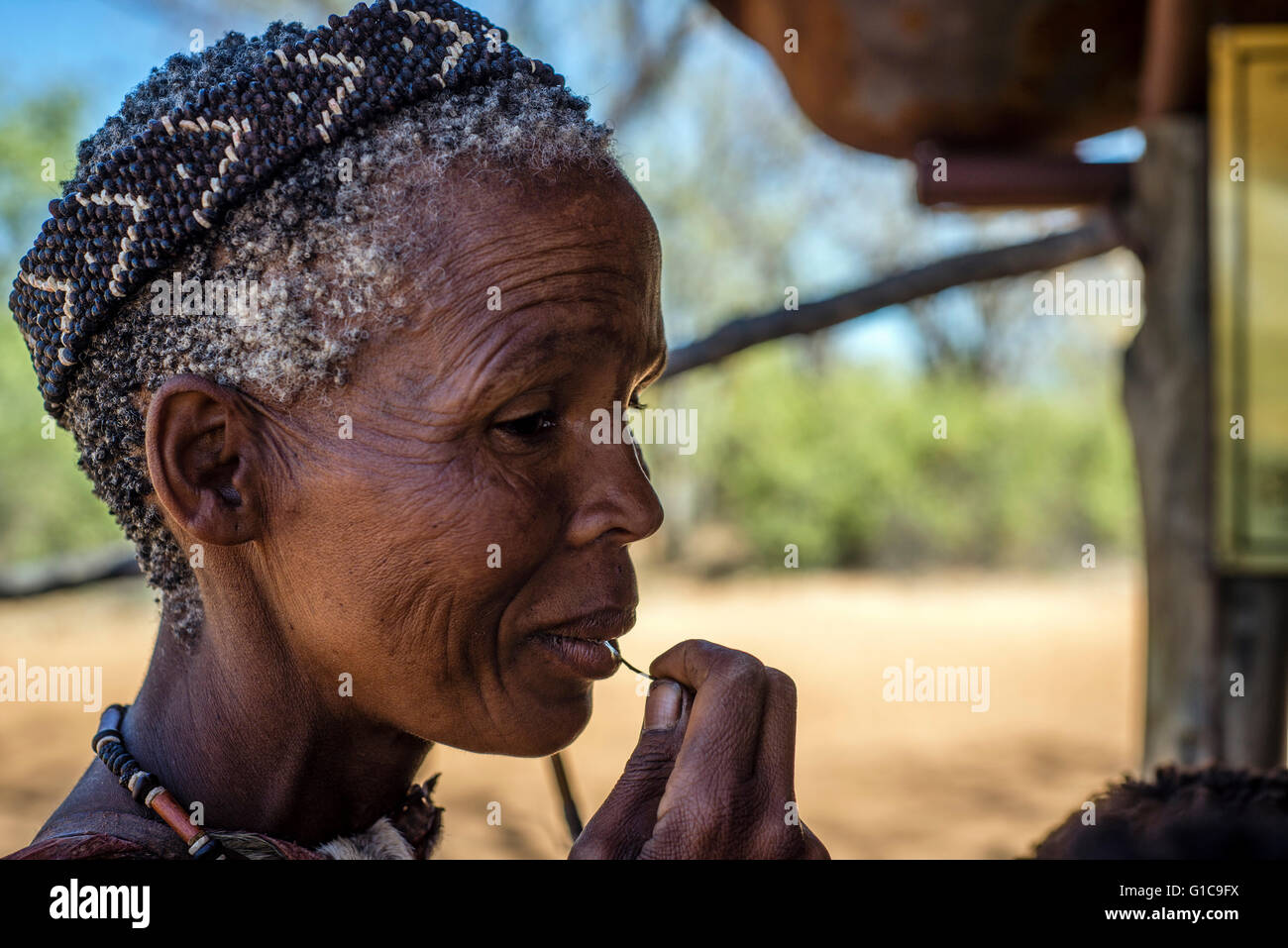 Portrait of a woman from the San tribe in the Living Museum of the Ju ...