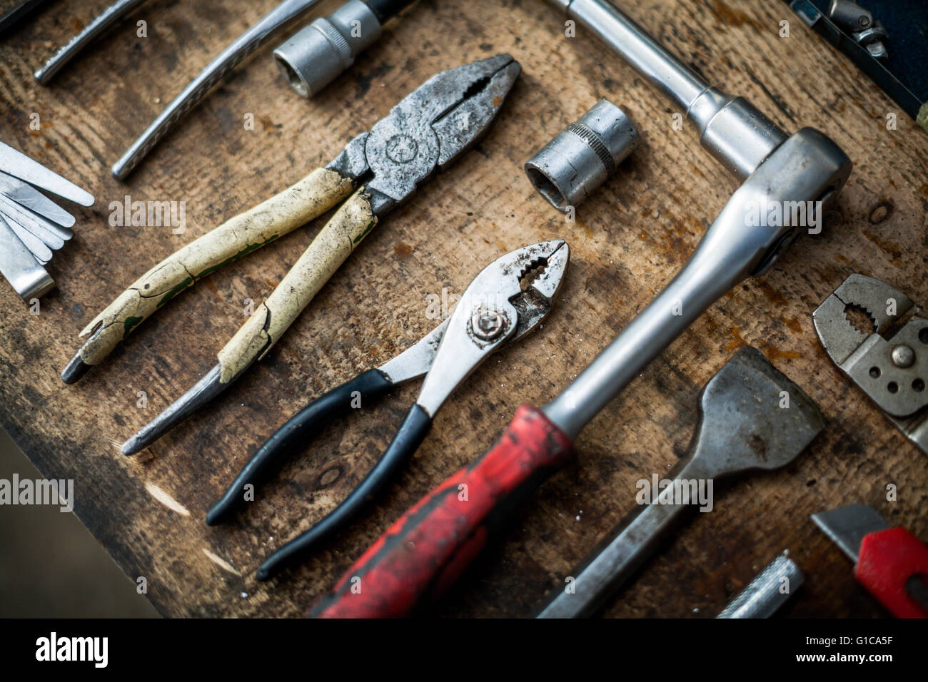 Color image of many tools on a wooden plank Stock Photo - Alamy
