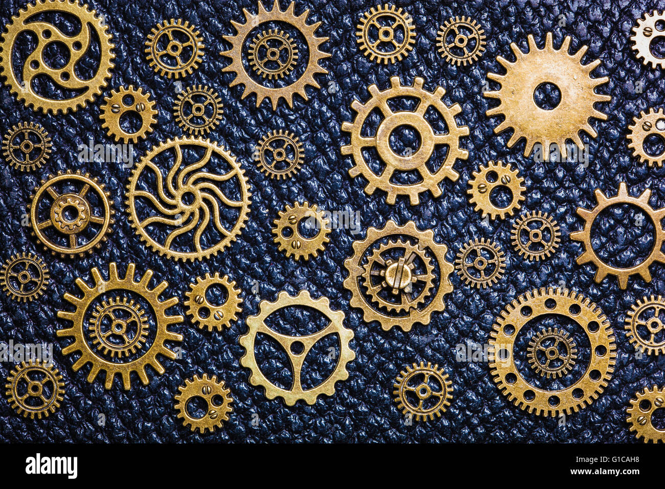 steampunk mechanical cogs gears wheels on leather background Stock ...