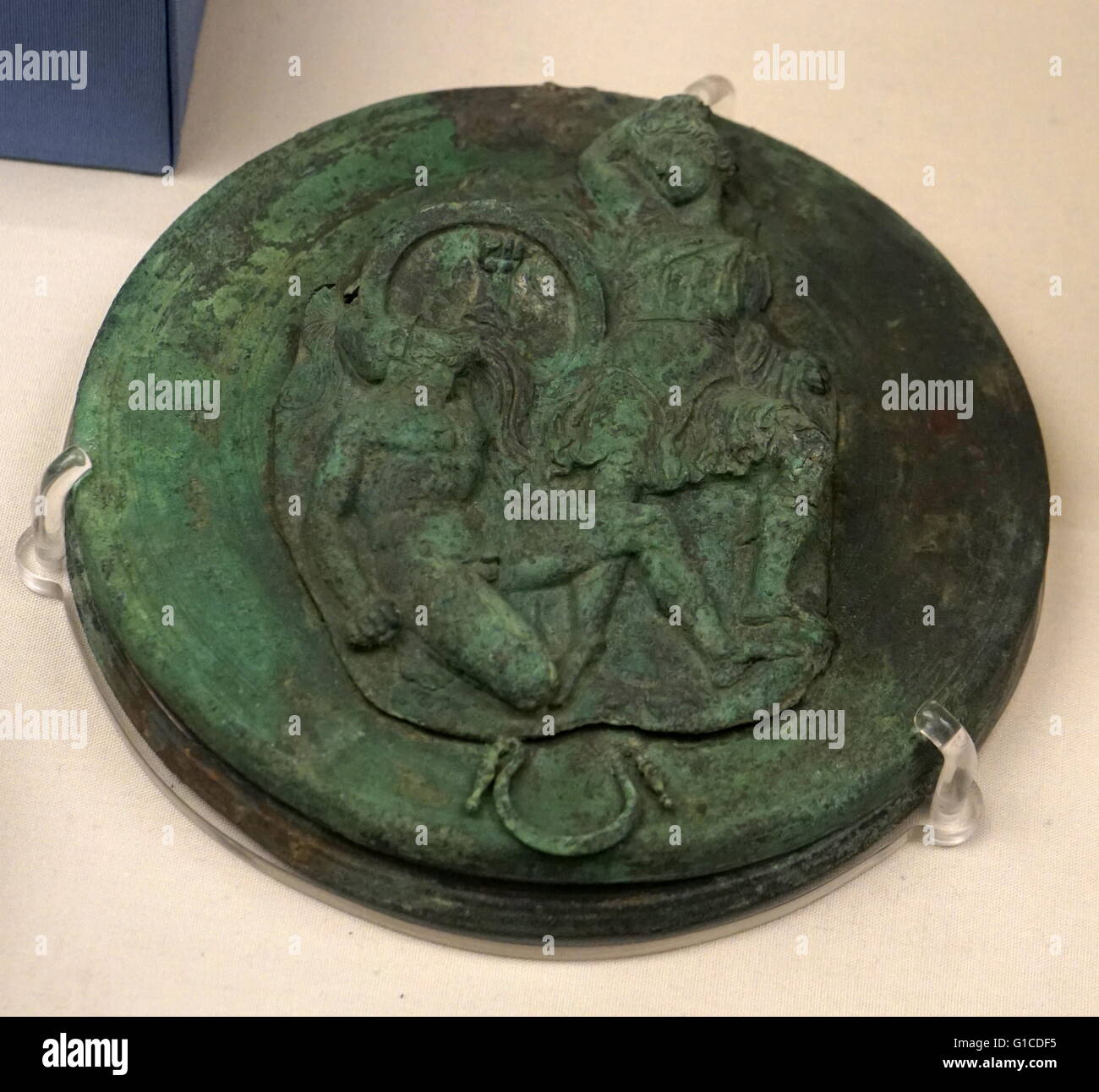 Bronze repousse relief depicting a Nike sacrificing a bull. Dated 350 ...