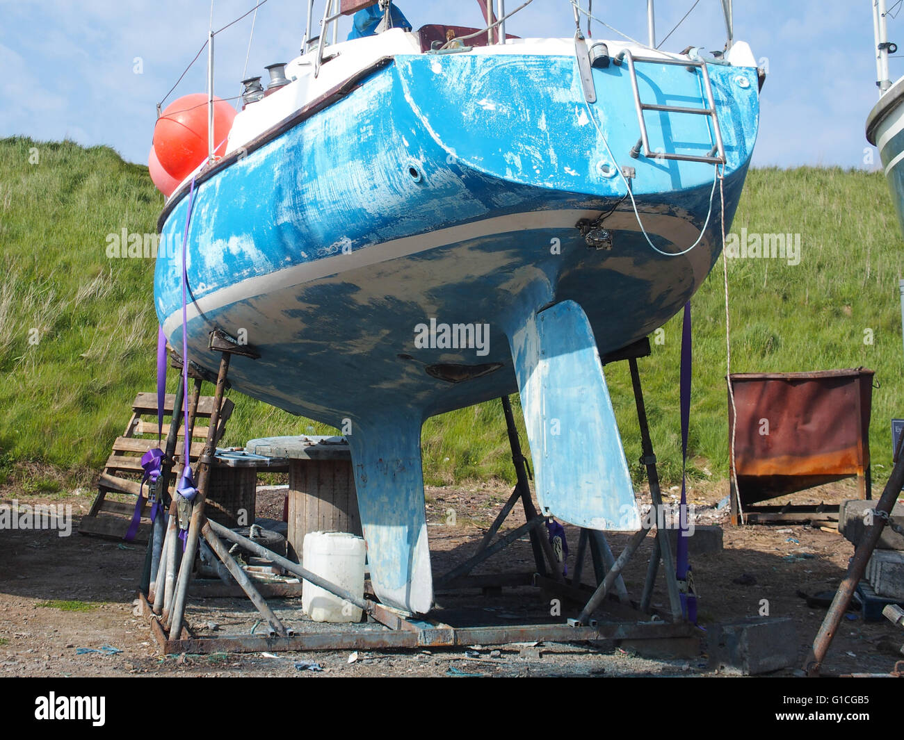 Yacht awaiting maintenance at Eyemouth Harbour Stock Photo - Alamy