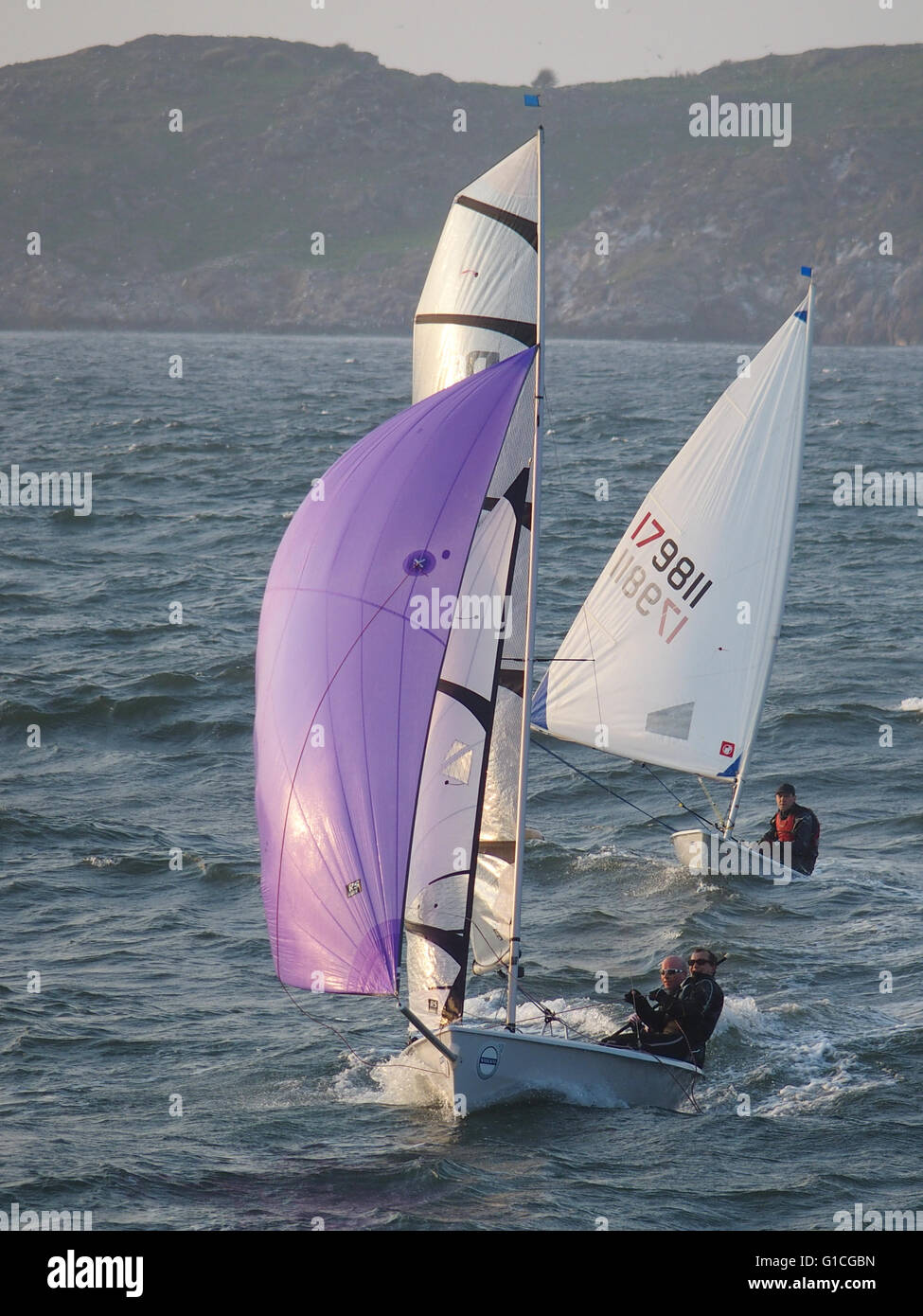 Sailing dinghies returning to beach, after racing Stock Photo - Alamy