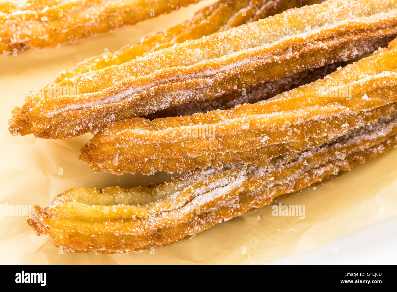 Bunch of curros covered with granulated sugar Stock Photo - Alamy