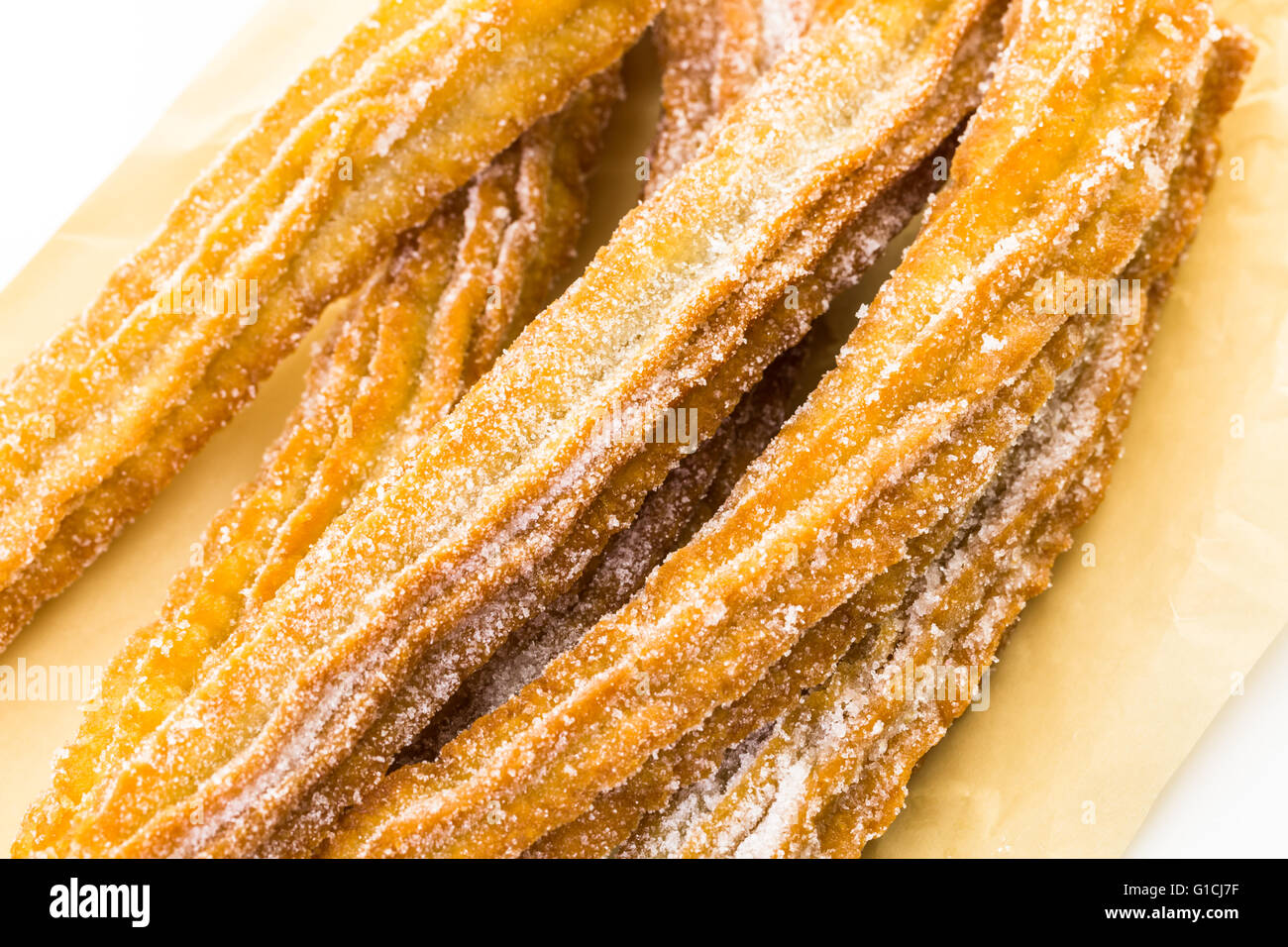 Bunch of curros covered with granulated sugar Stock Photo - Alamy