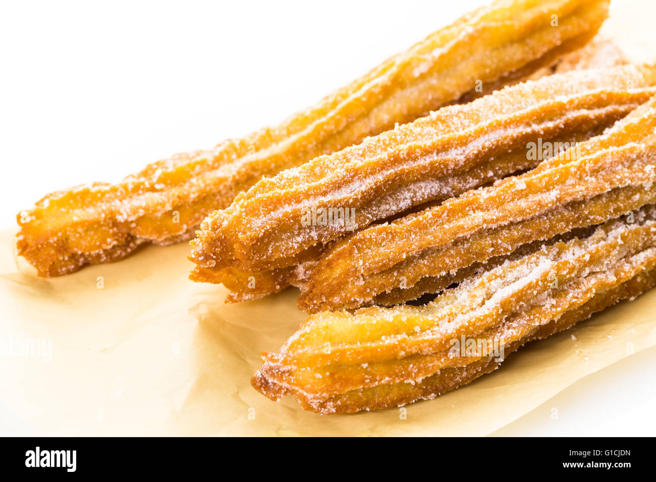 Bunch of curros covered with granulated sugar Stock Photo - Alamy