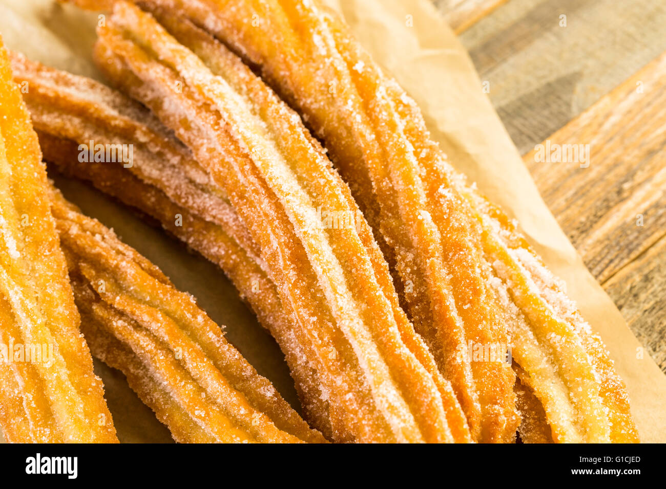 Bunch of curros covered with granulated sugar Stock Photo - Alamy