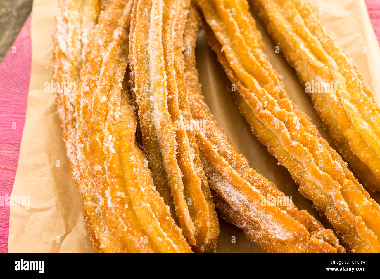 Bunch of curros covered with granulated sugar Stock Photo - Alamy