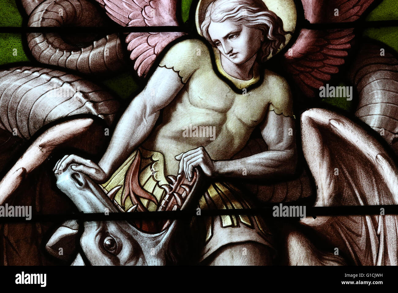 Basilica Notre-Dame of Geneva. Stained glass window. Angel fighting ...