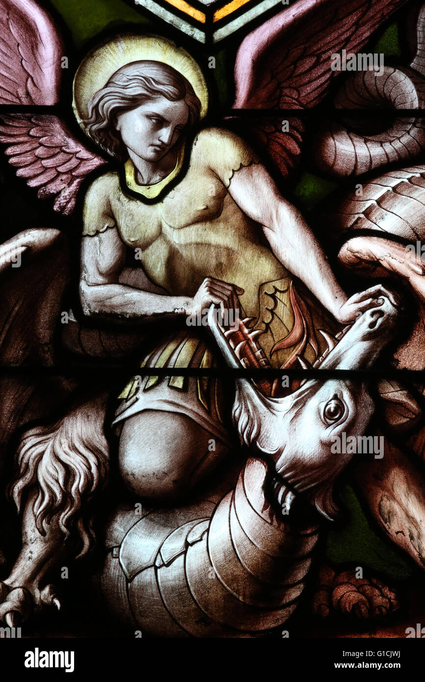 Basilica Notre-Dame of Geneva. Stained glass window. Angel fighting ...