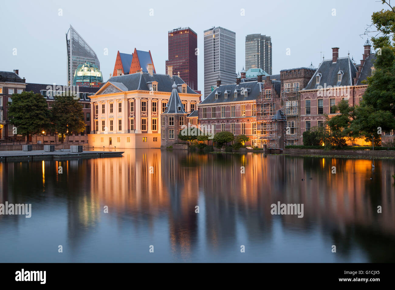 Evening view on Binnenhof Palace and high modern buildings in Hague ...