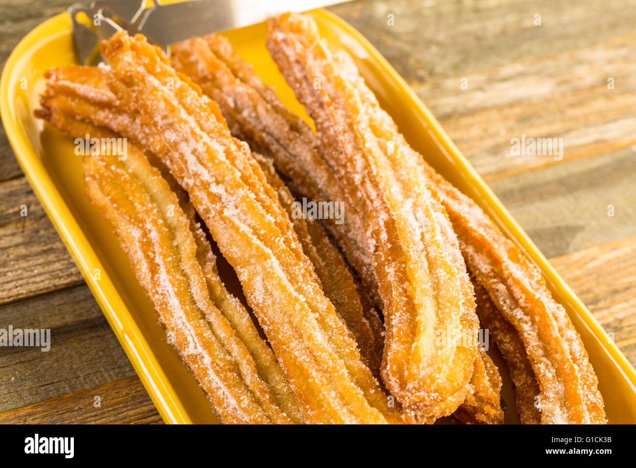Bunch of curros covered with granulated sugar Stock Photo - Alamy