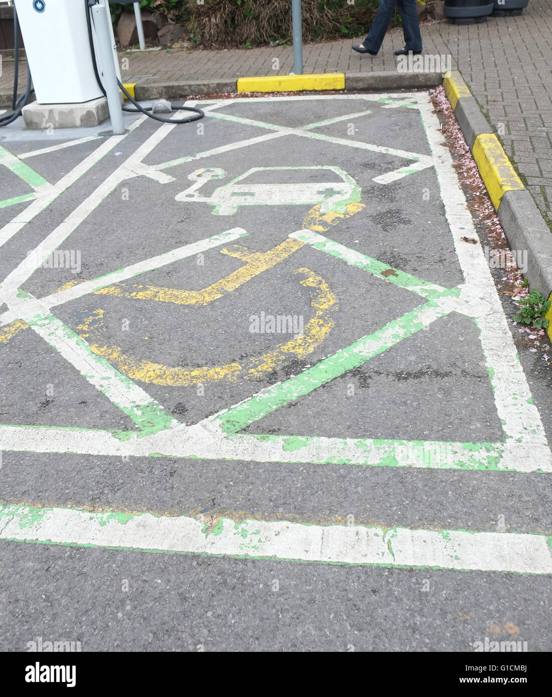 Disabled car parking bay painted out in favor of an electric car ...