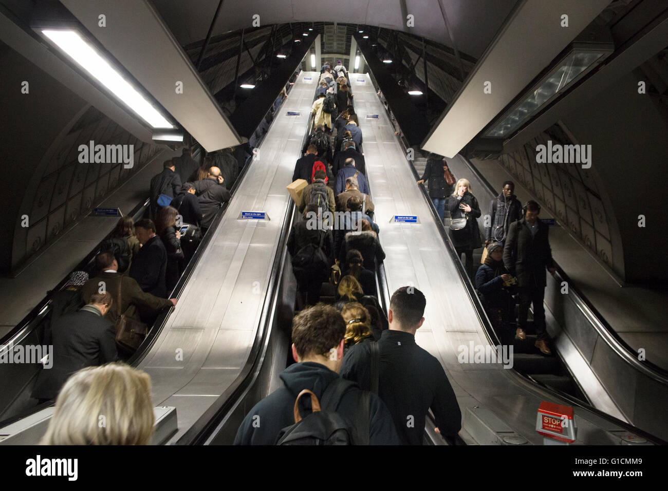Commuters traveling up the escalator at London Bridge tube station ...